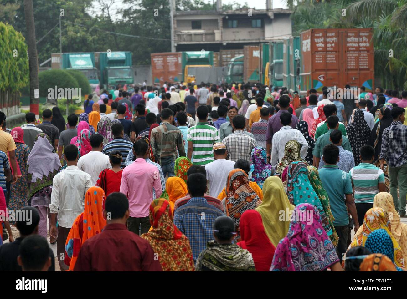 Garment workers are in a long queue to join their workplace in Ashulia ...