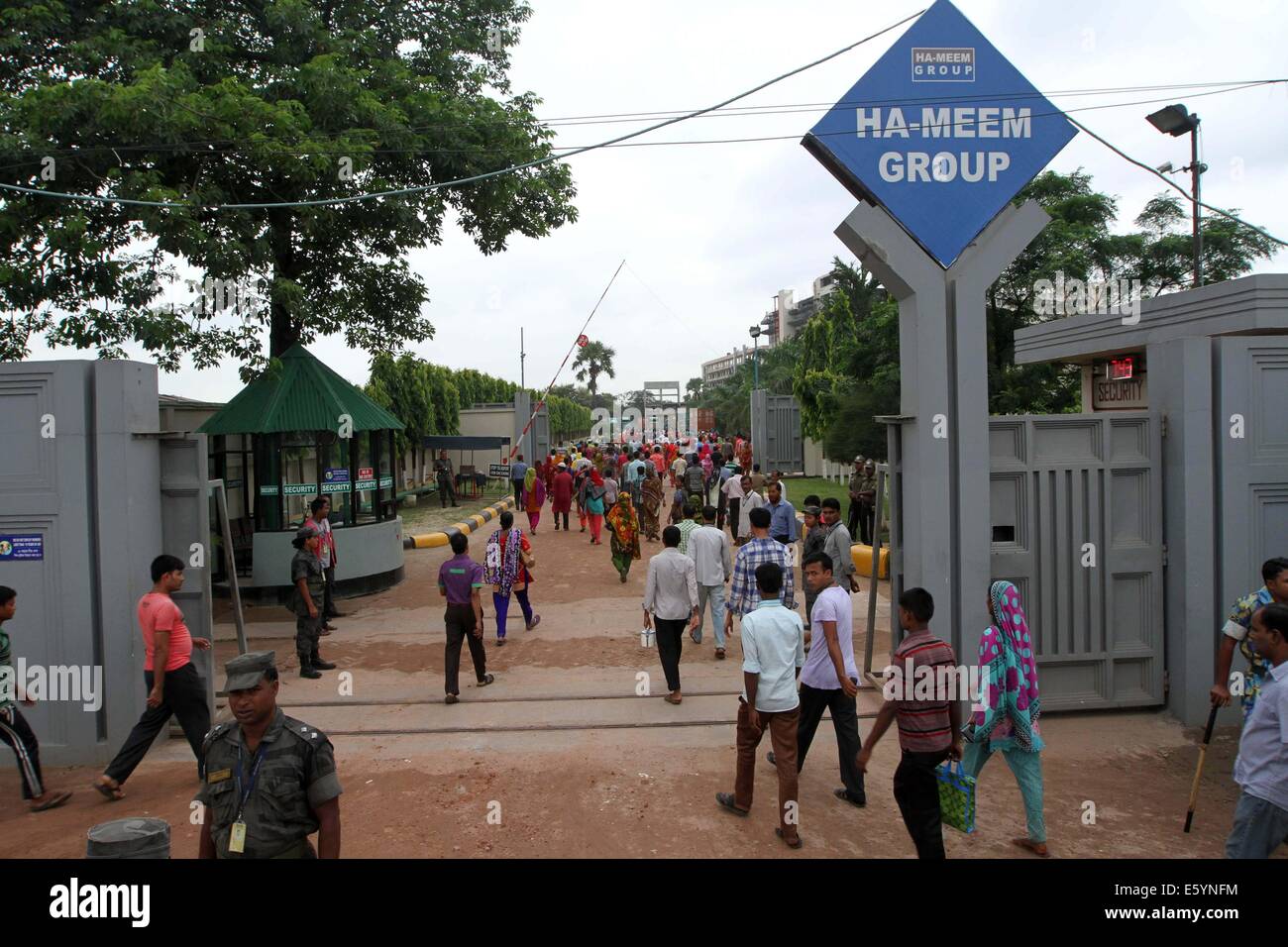 Garment workers are in a long queue to join their workplace in Ashulia ...