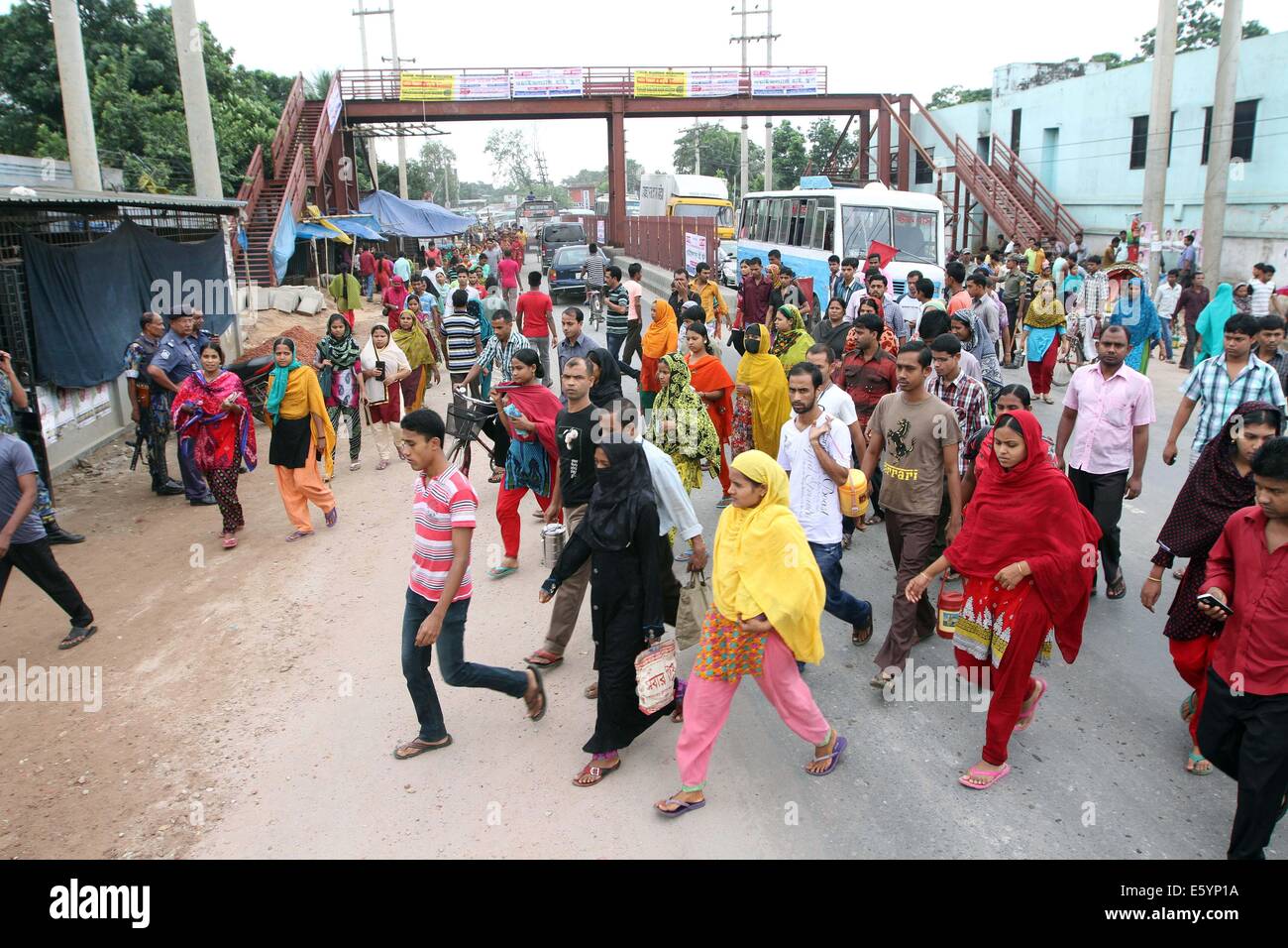 Garment workers are in a long queue to join their workplace in Ashulia ...