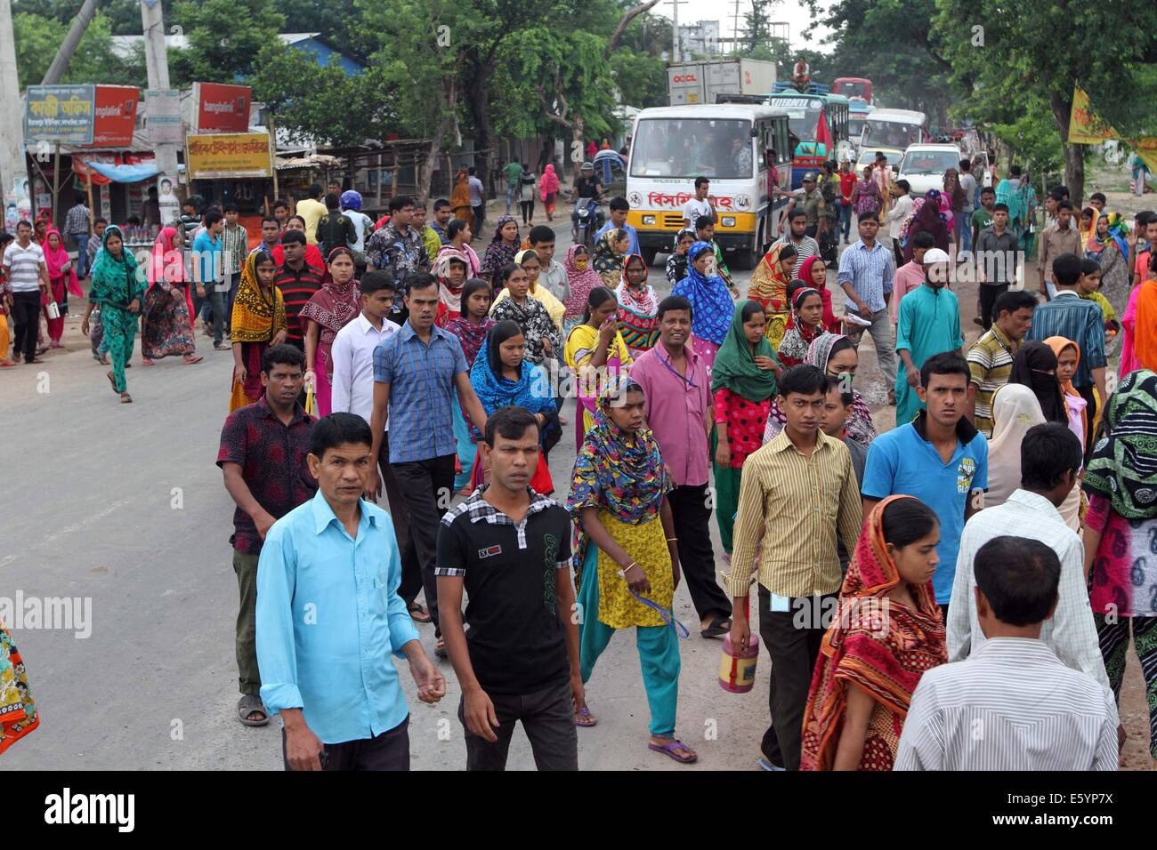 Garment workers are in a long queue to join their workplace in Ashulia ...