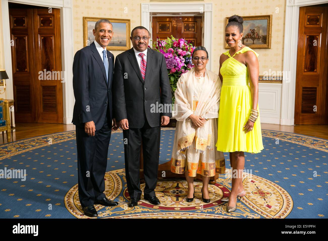 US President Barack Obama and First Lady Michelle Obama pose with ...