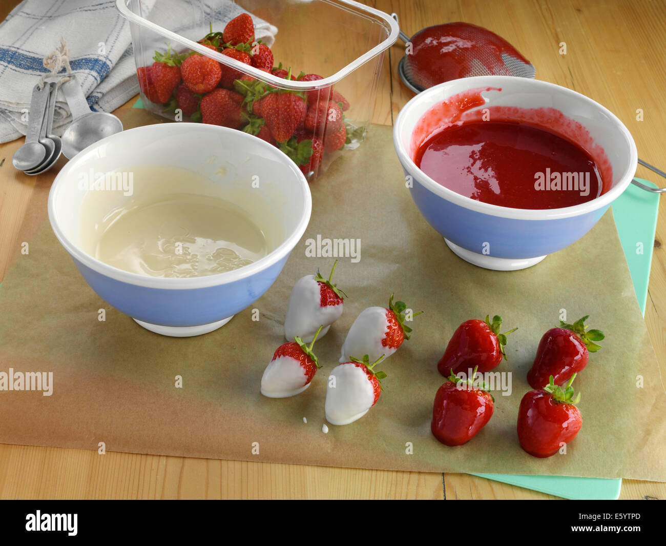 Kitchen preparation white chocolate dipped strawberries hi-res stock ...