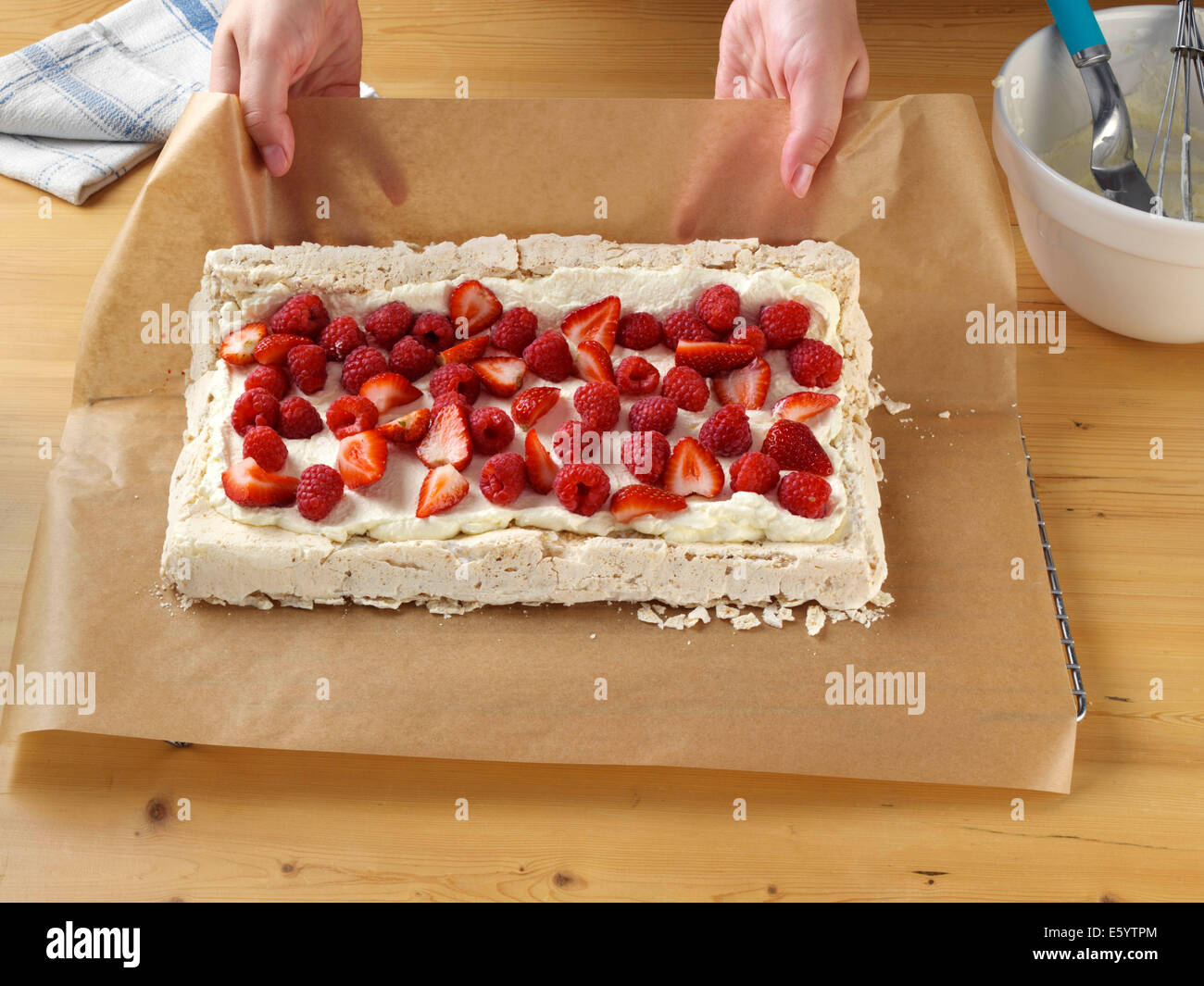 Rolling up a roulade Stock Photo - Alamy