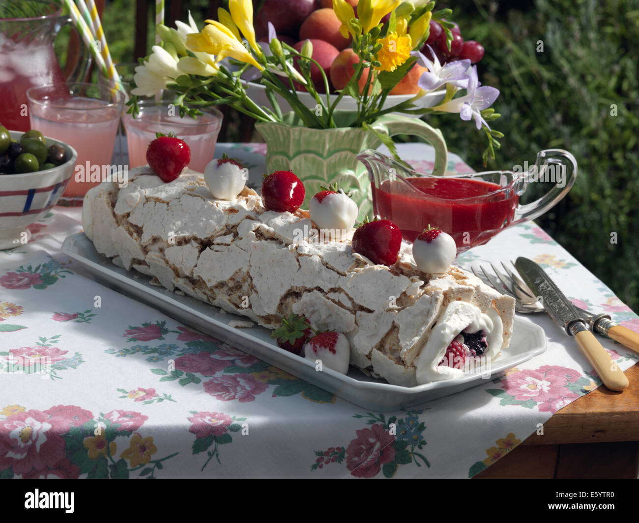 Family sized hazelnut summer berry meringue roulade hi-res stock ...