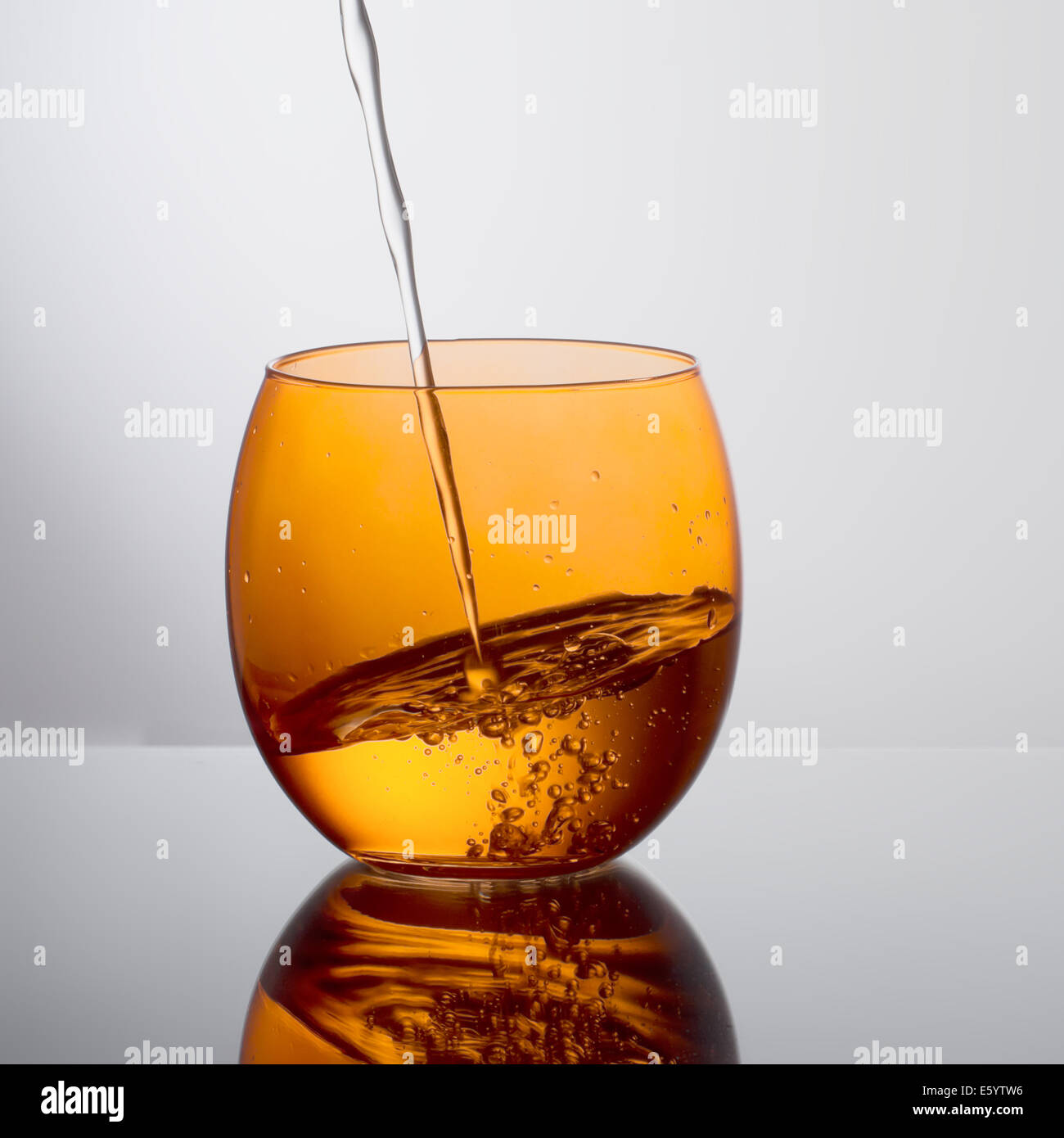 Dramatic lighting, water being poured at unusual angle Stock Photo - Alamy