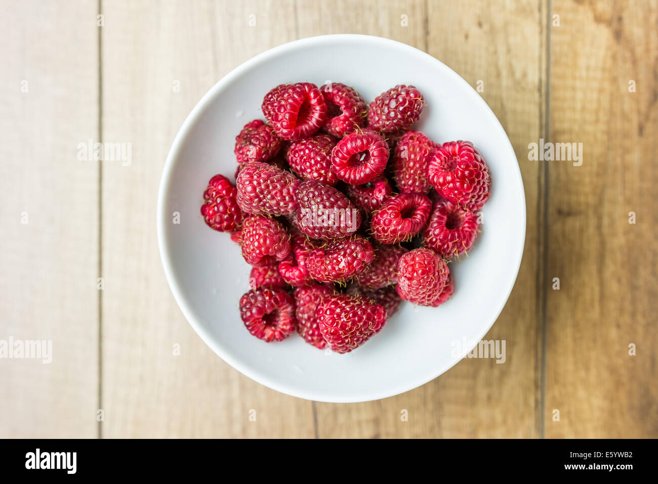 Fresh Raspberry Fruits In White Bowl Stock Photo - Alamy