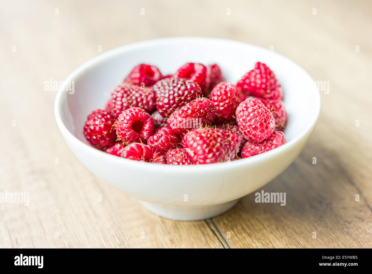 Fresh raspberry in bowl hi-res stock photography and images - Alamy
