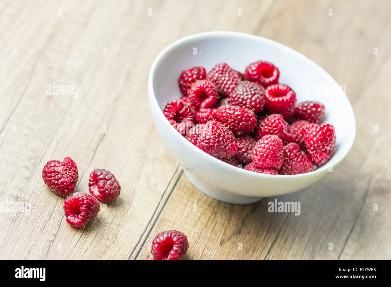 Fresh Raspberry Fruits In White Bowl Stock Photo - Alamy