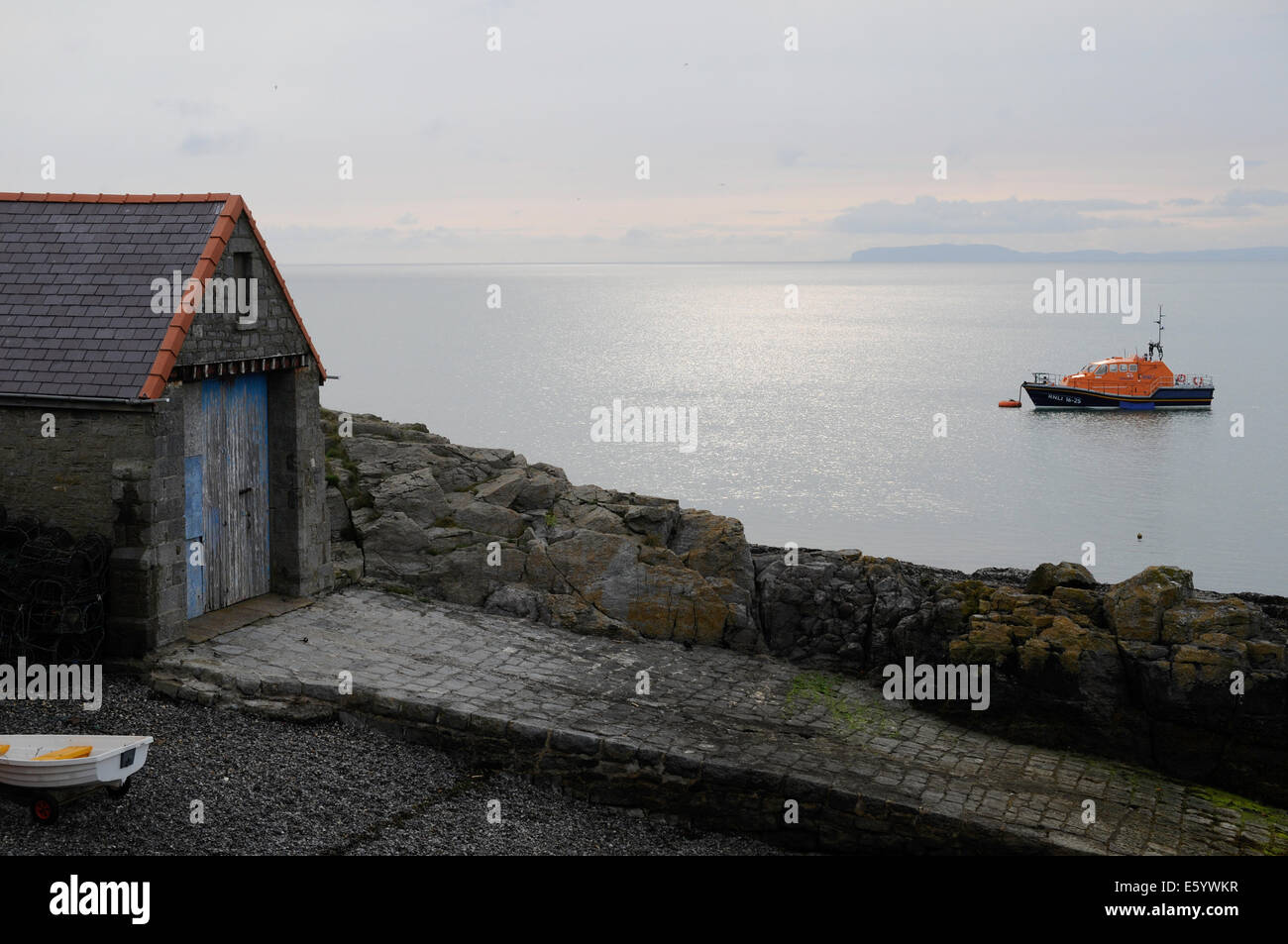 An RNLI Lifeboat behind the old Lifeboat house at Moelfre on Anglesey ...