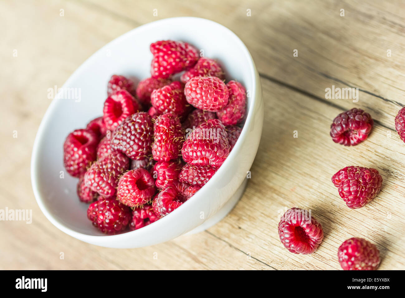 Fresh Raspberry Fruits In White Bowl Stock Photo - Alamy