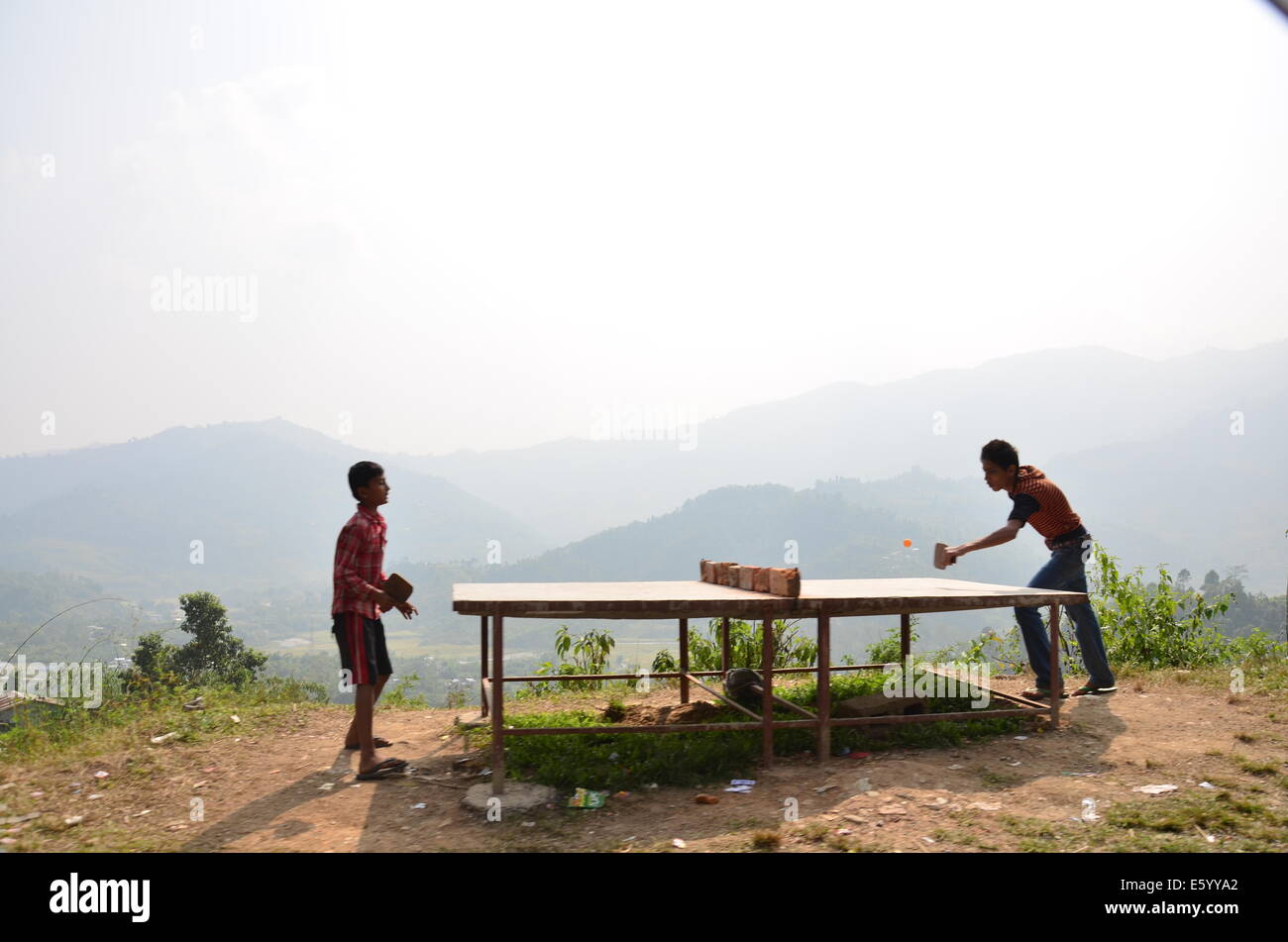 Two boys playing tennis table hi-res stock photography and images - Alamy