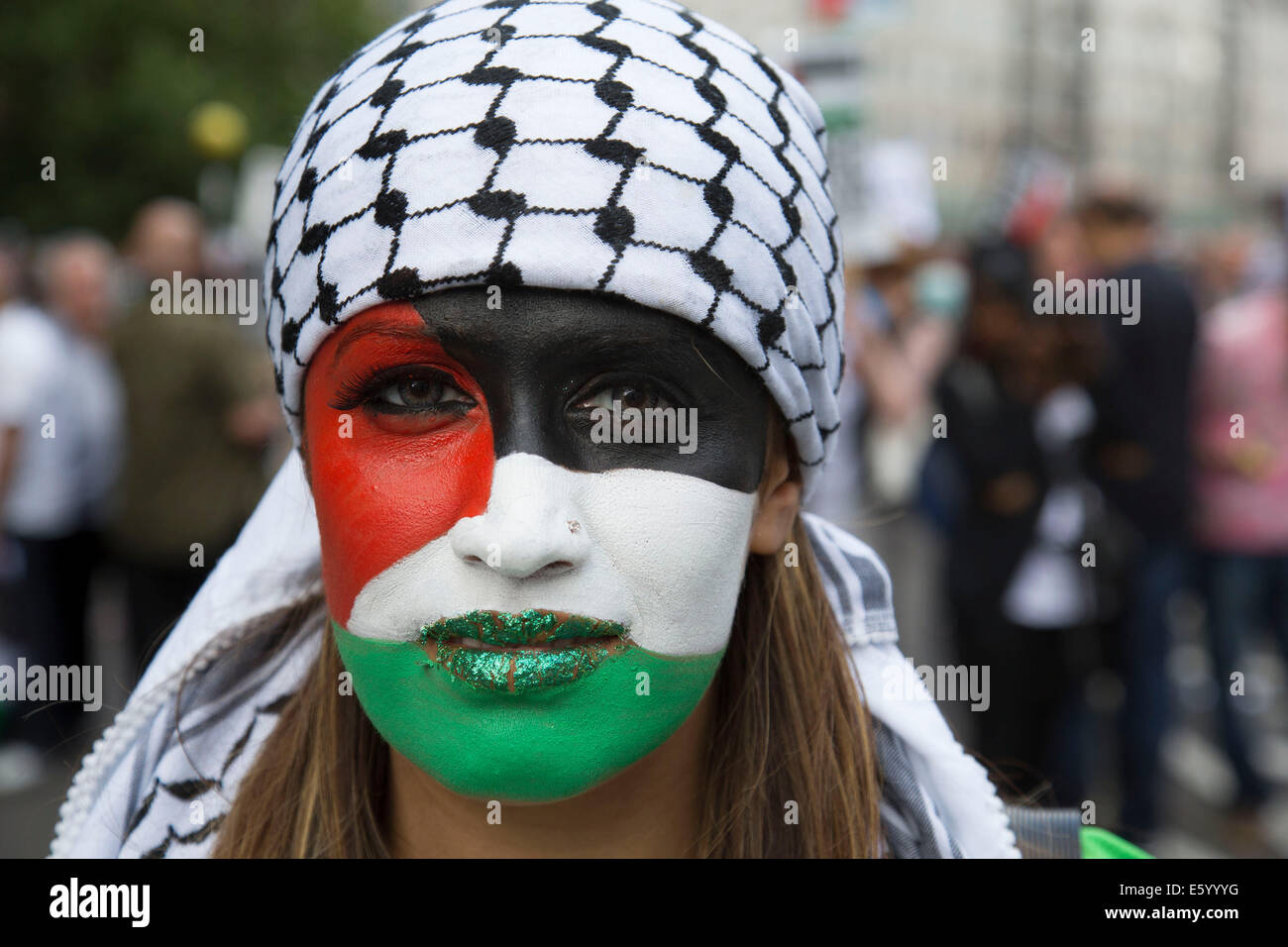 London, UK. Saturday 9th August 2014. Protester with her face painted ...
