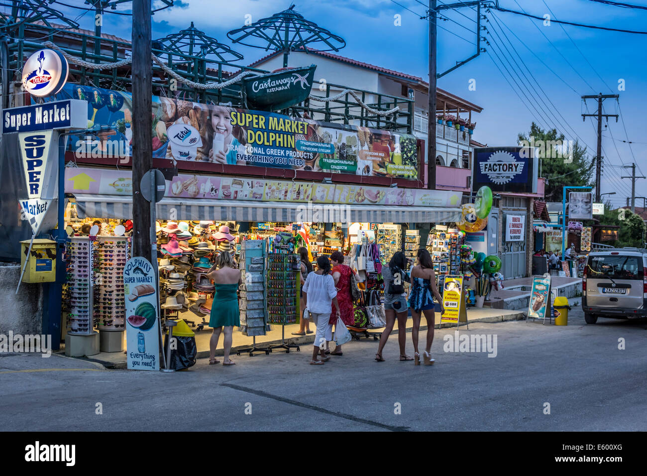 Zante, Greece - Argassi. Village centre street, evening. Supermarket ...