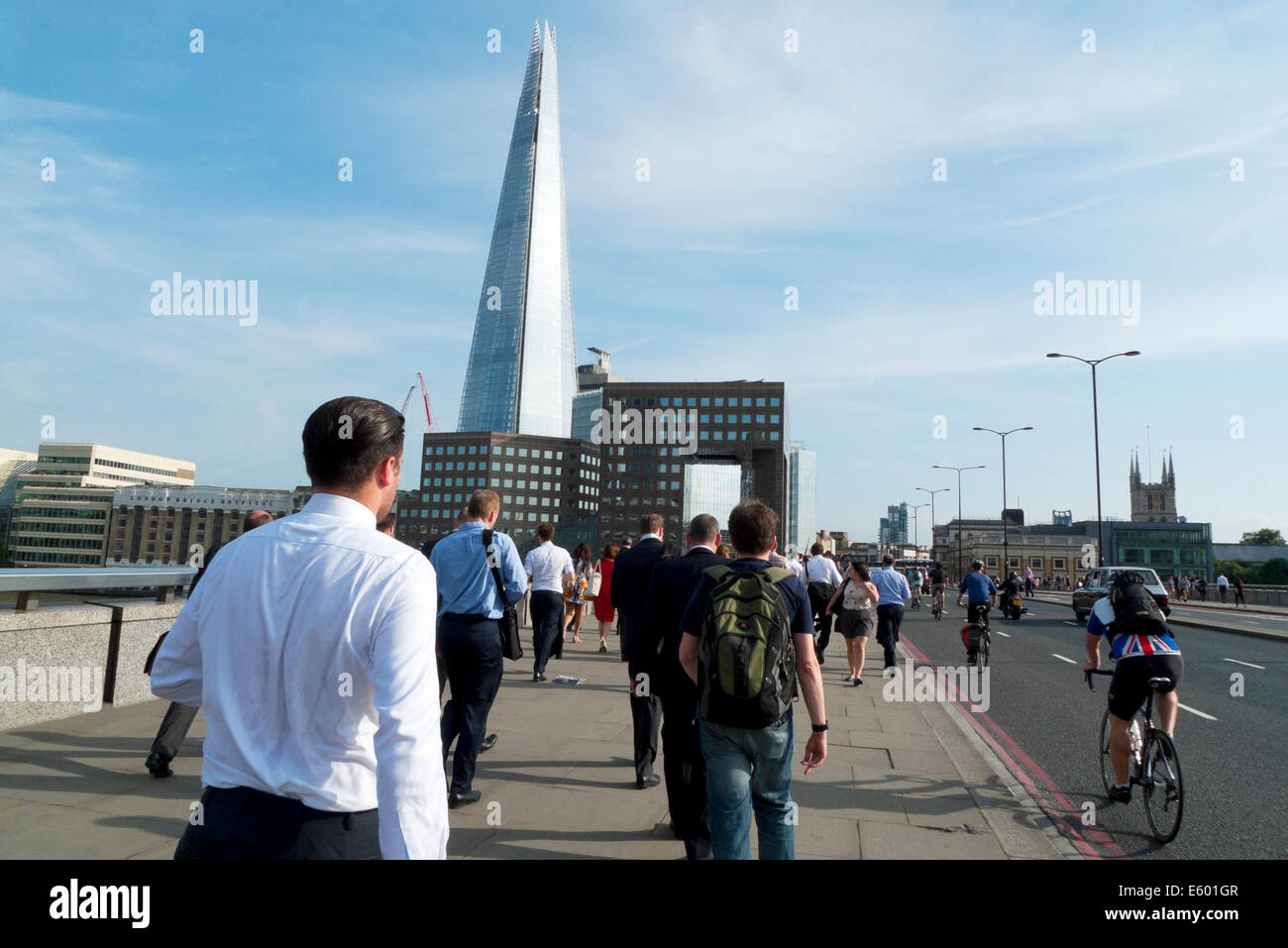 City of London businessman in crowd of office workers walking home over ...