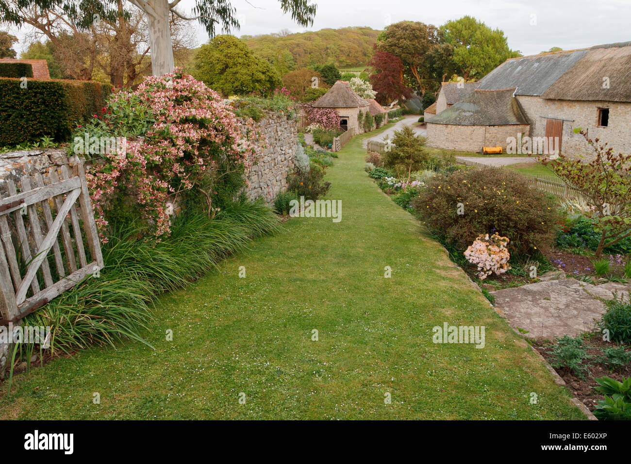 Medieval barns in the estate village of East Quantoxhead Stock Photo ...