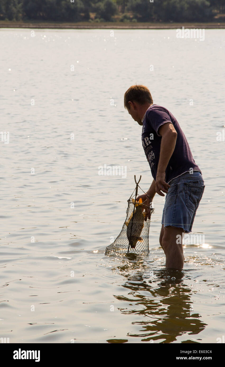 Fisherman fighting hi-res stock photography and images - Alamy