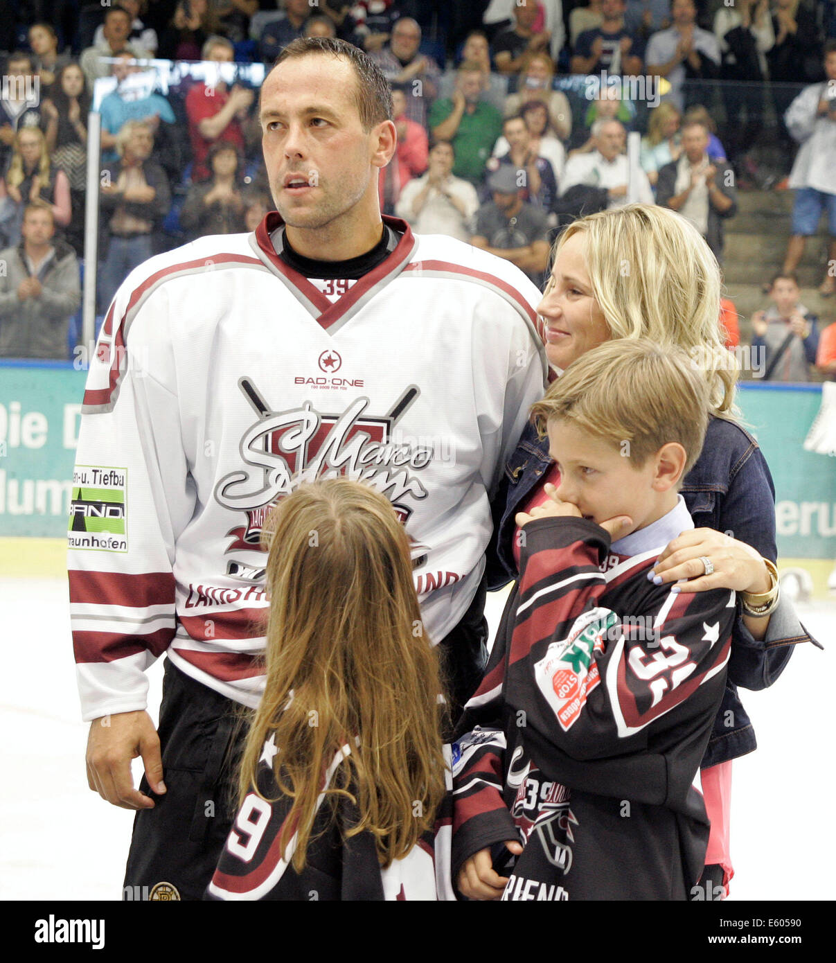 Landshut, Germany. 9th Aug, 2014. Marco Sturm with his family after the ...