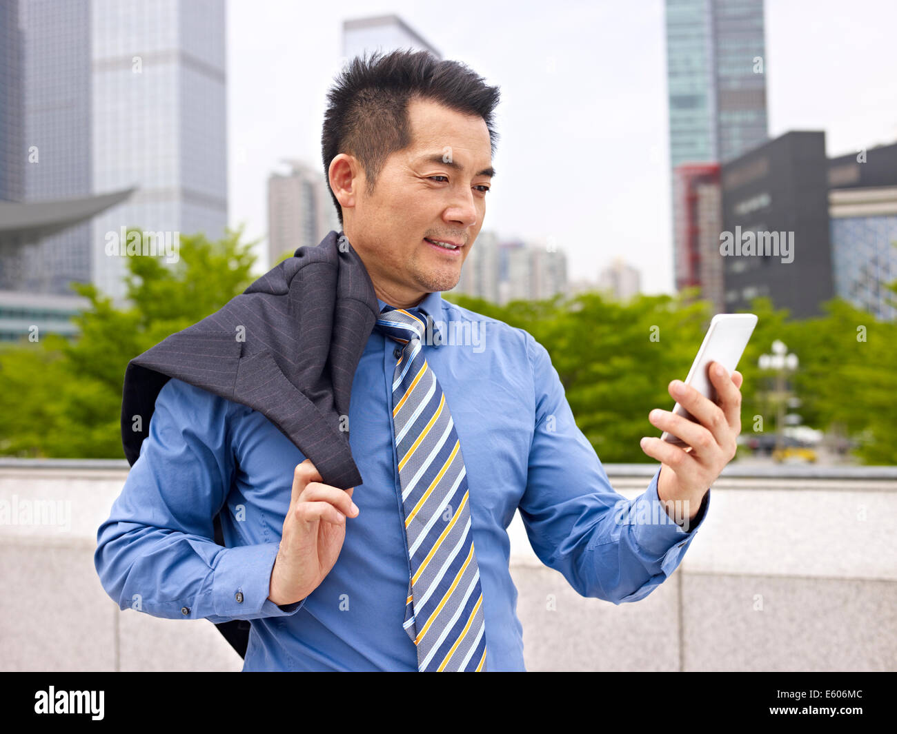 Asian businessman using mobile smartphone hi-res stock photography and ...