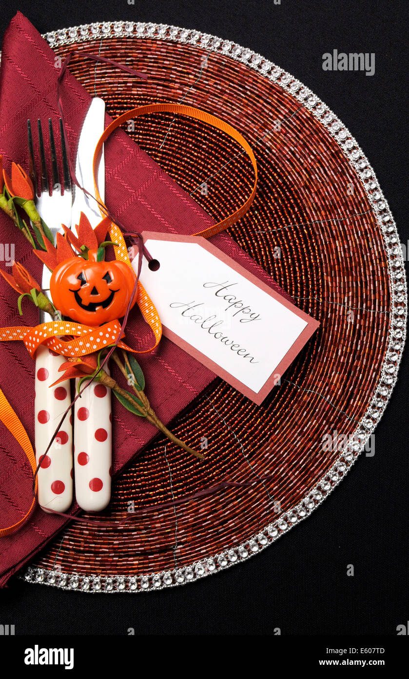 Happy Halloween table place setting with red polka dot cutlery and ...