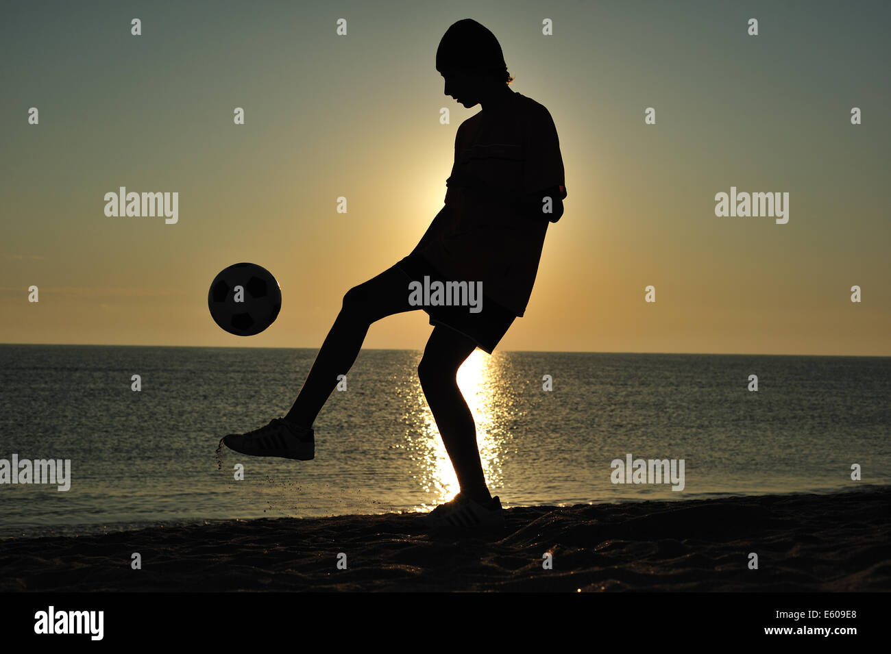 Football on beach hi-res stock photography and images - Alamy