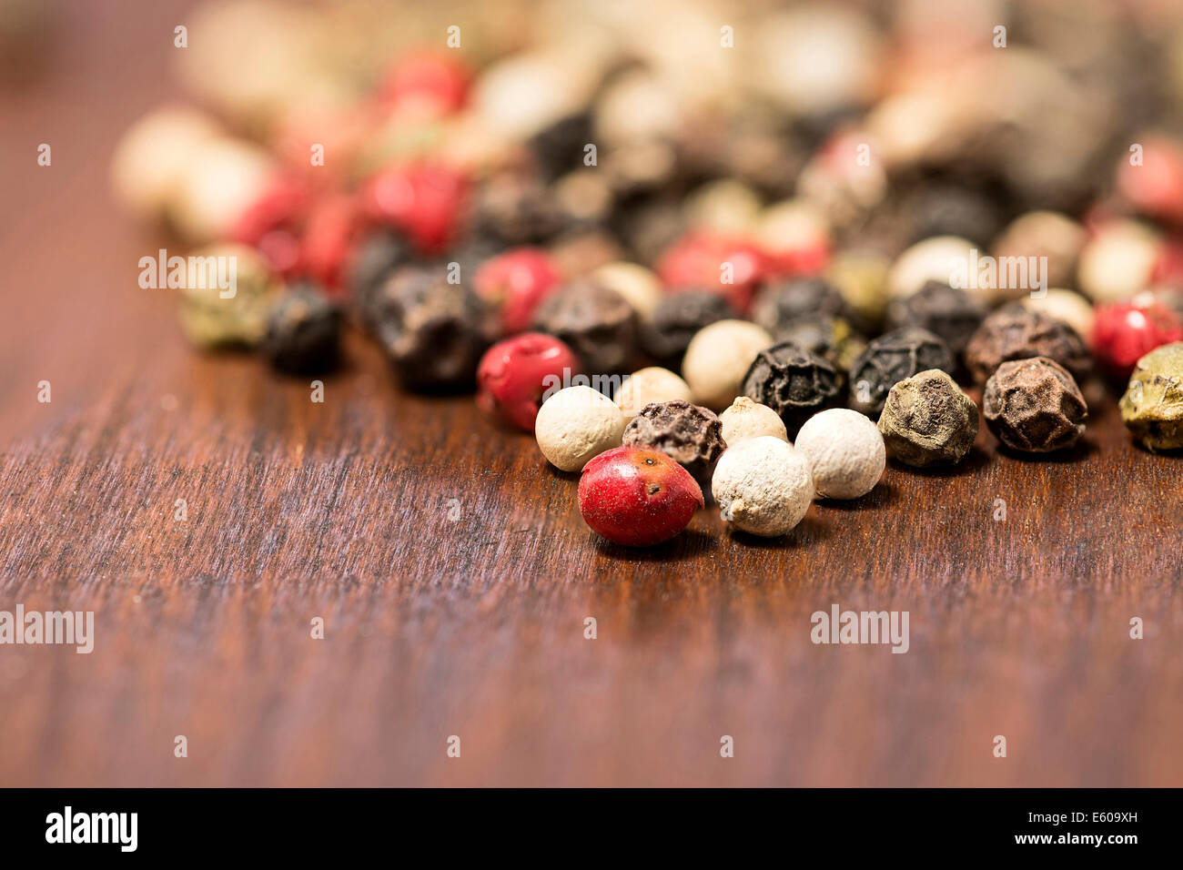Colored Peppers Mix on a wooden background Stock Photo - Alamy