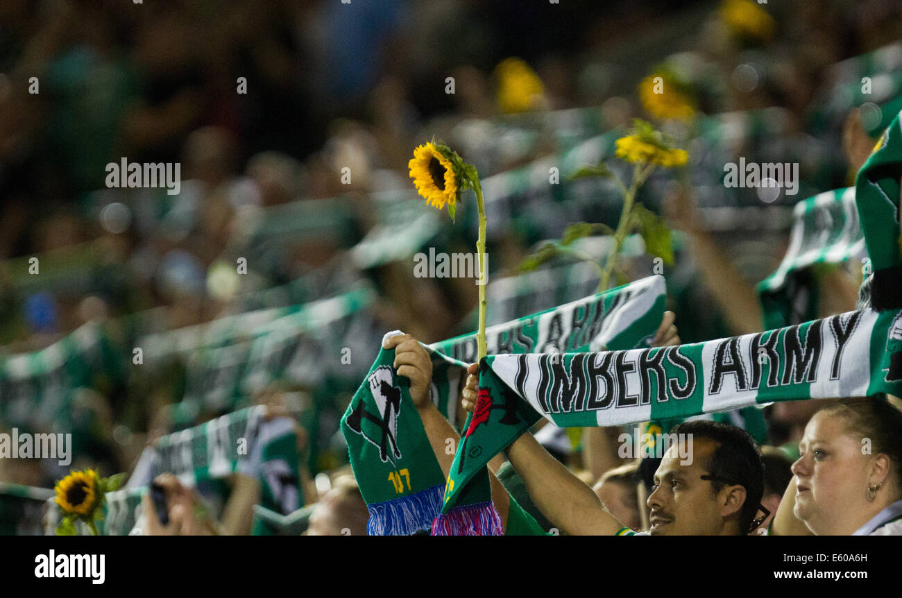 Aug. 9, 2014 - Timbers Army hold up sunflowers in honor of former ...