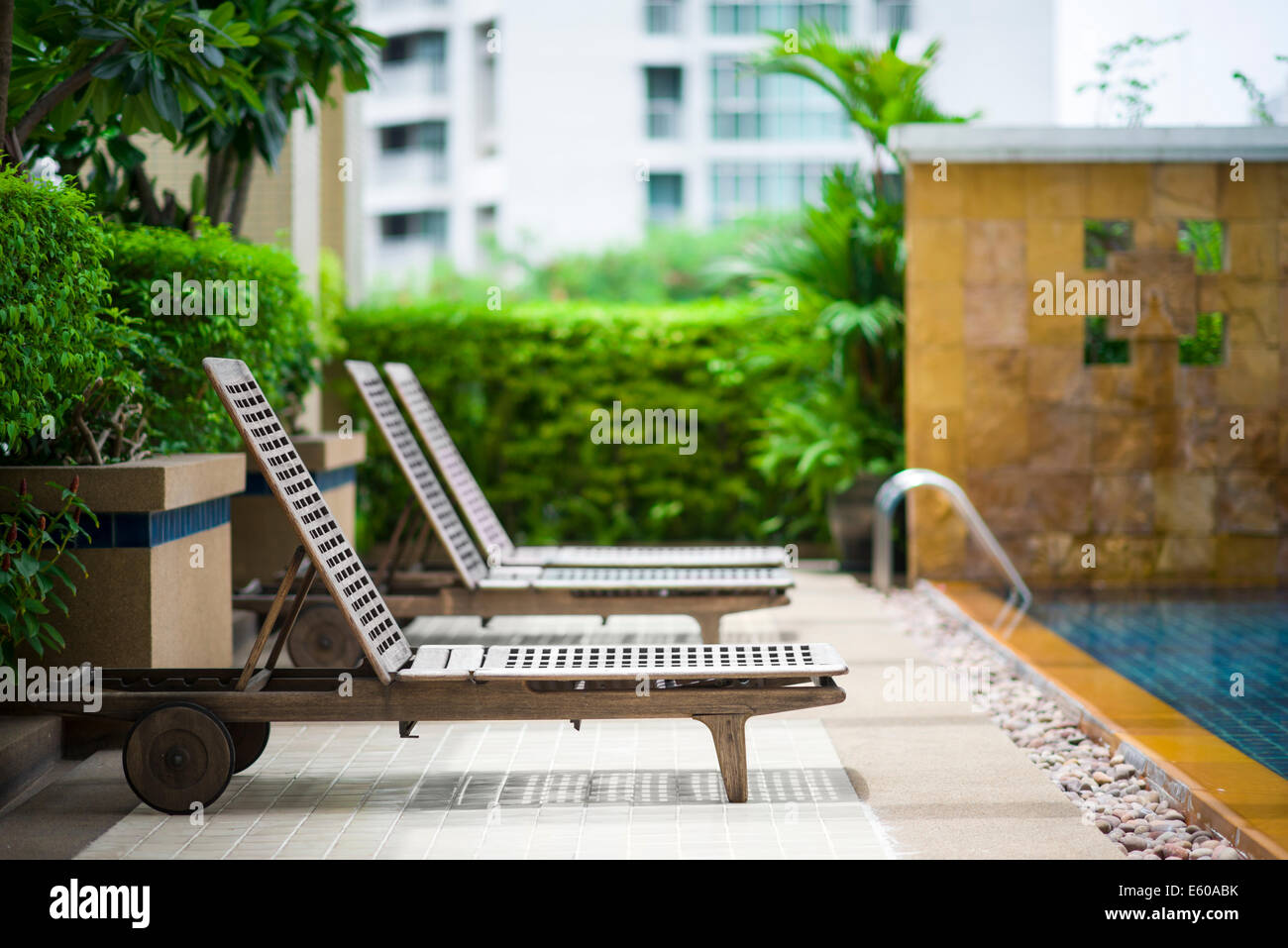 Poolside lounge chair Stock Photo - Alamy