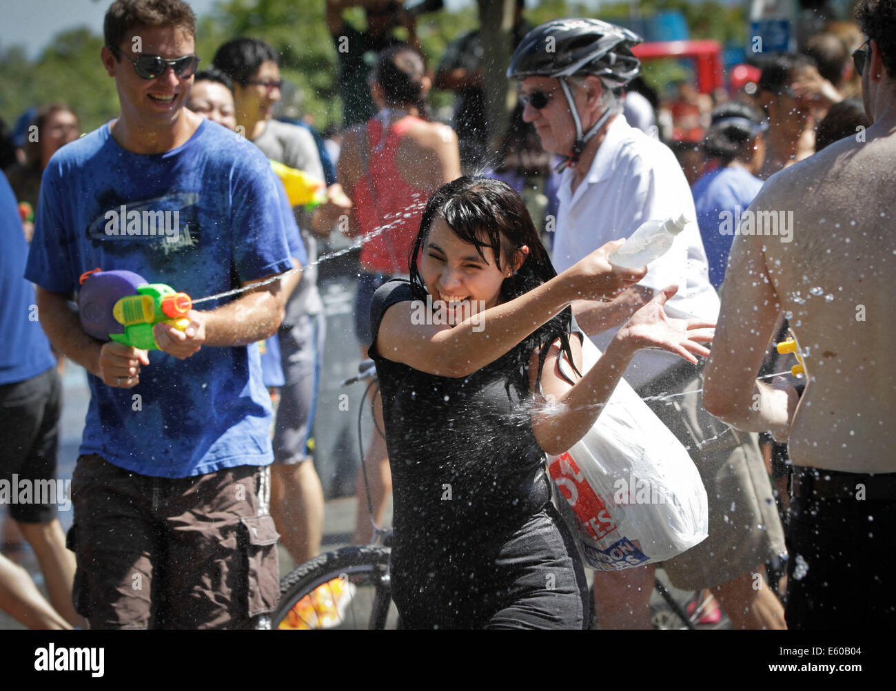 Vancouver, Canada. 9th Aug, 2014. People shoot each other with water ...