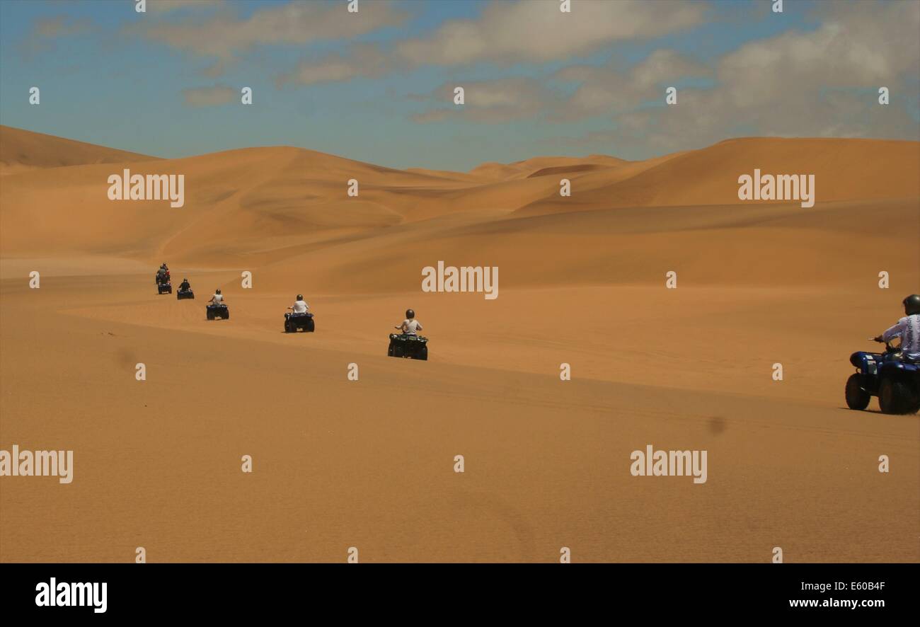 ATV Quad biking through the sand dunes of the Namib desert, near ...