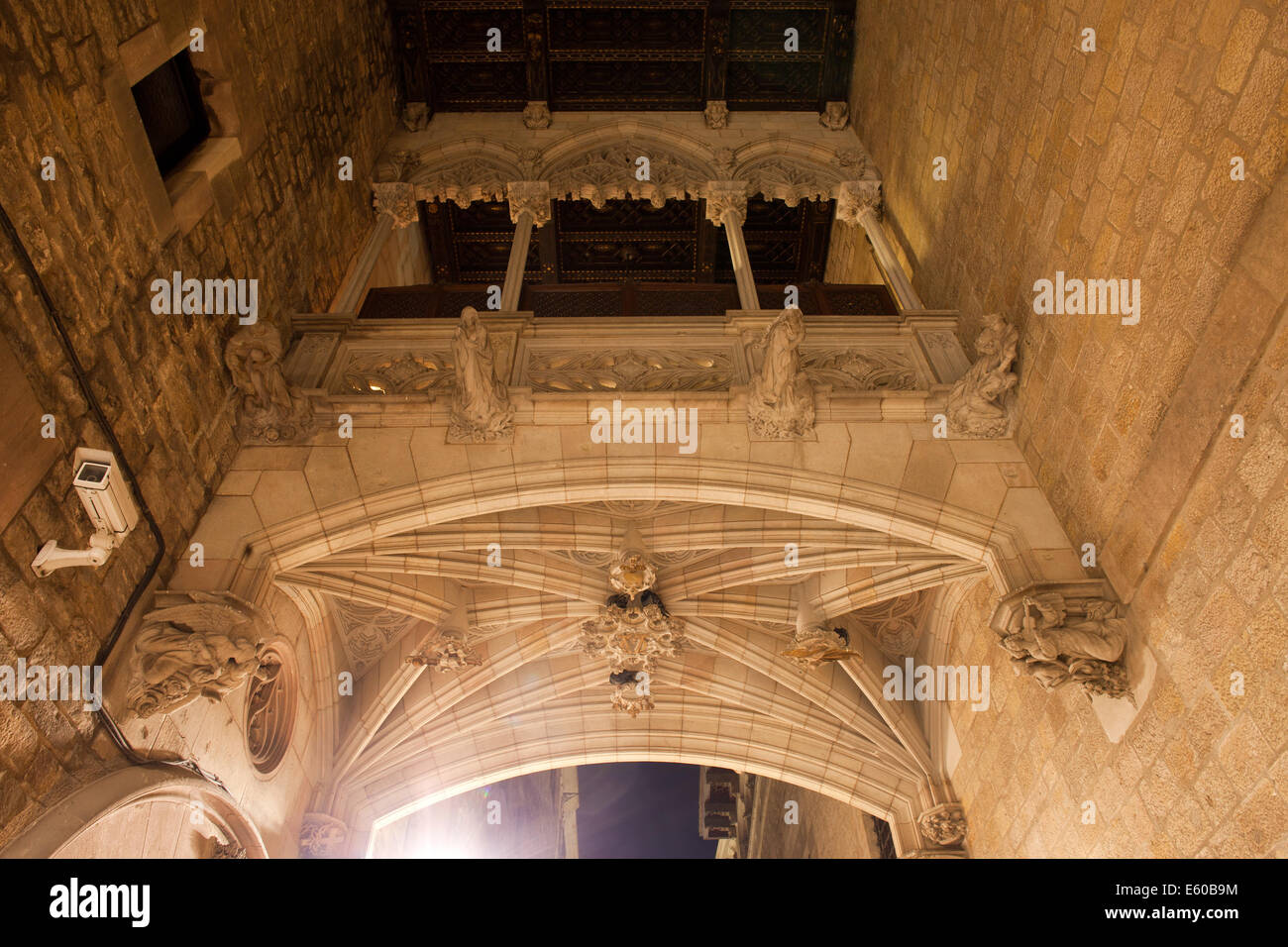 Gothic bridge at night, connects two buildings over the Carrer del ...