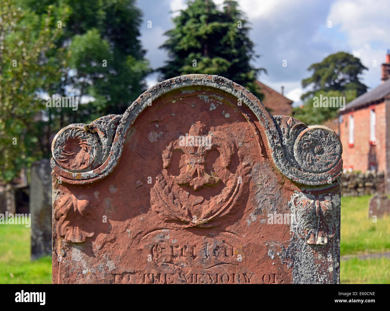 Badly eroded sandstone gravestone with floral design. Church of Saint ...