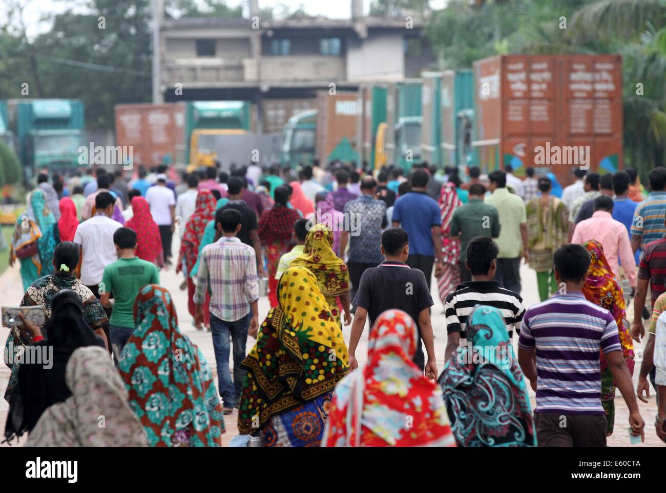 Garment workers are in a long queue to join their workplace in Ashulia ...