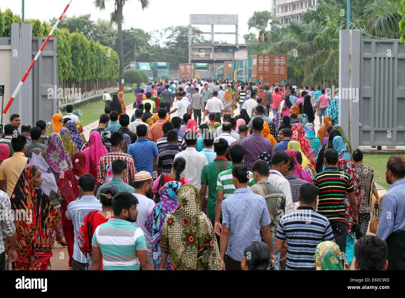 Garment workers are in a long queue to join their workplace in Ashulia ...