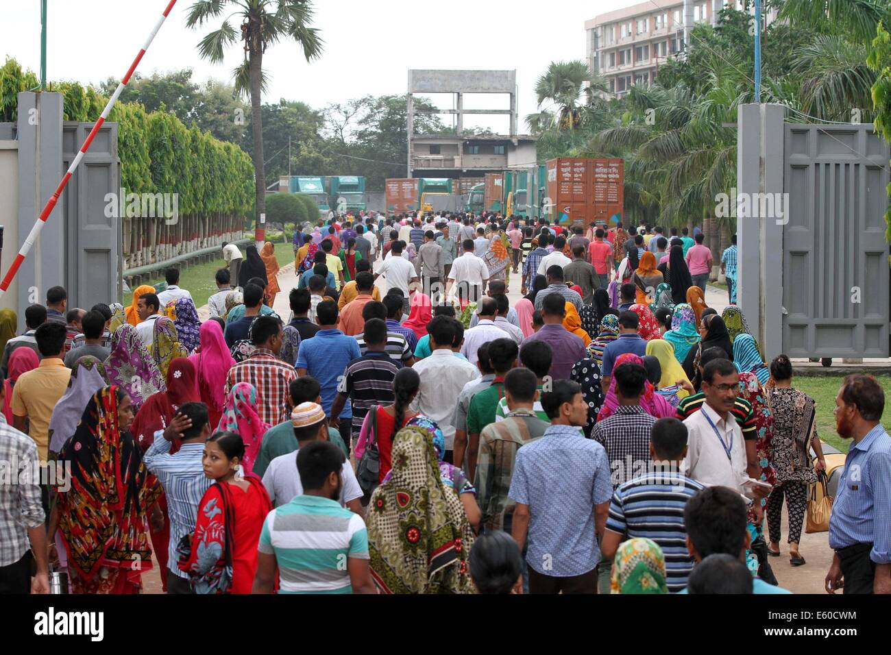 Garment workers are in a long queue to join their workplace in Ashulia ...