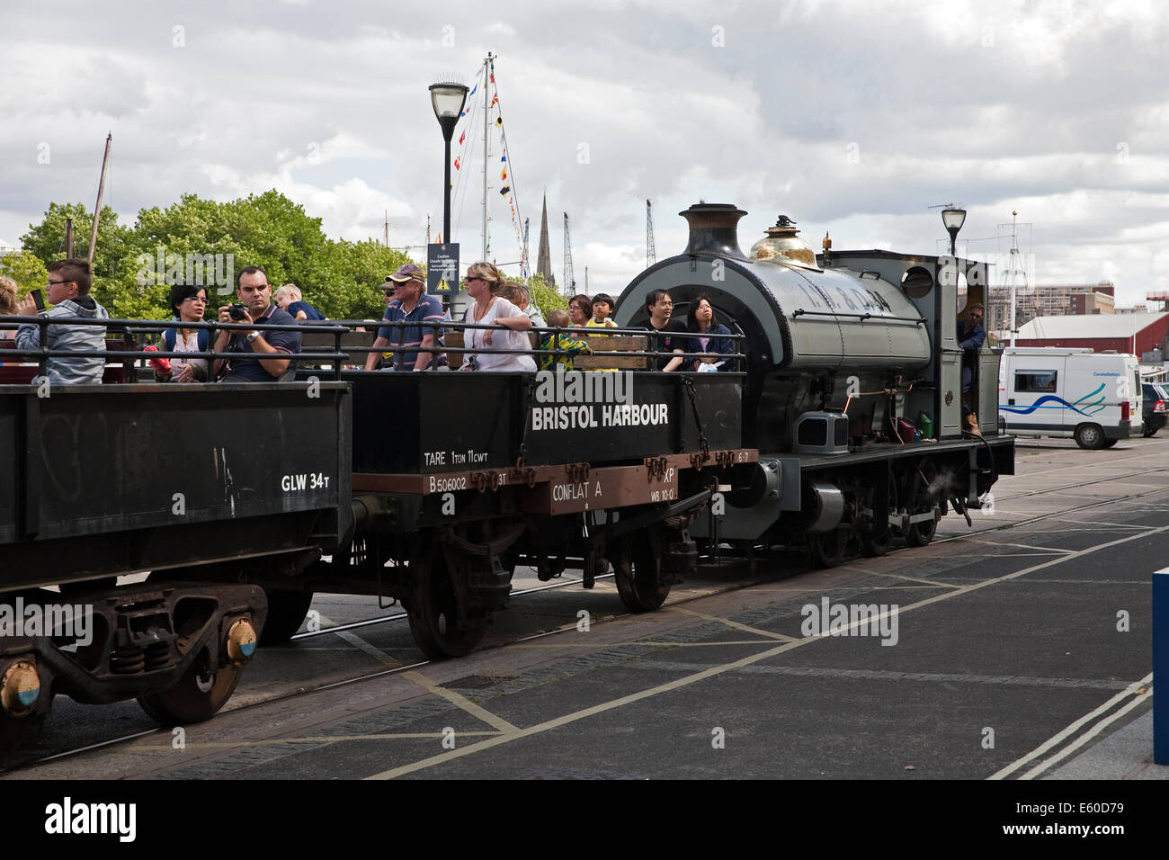 Open carriages are pulled by a steam engine along Bristol harbour Stock ...