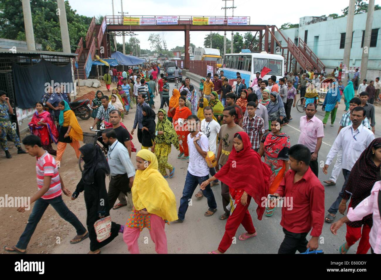 Garment workers are in a long queue to join their workplace in Ashulia ...