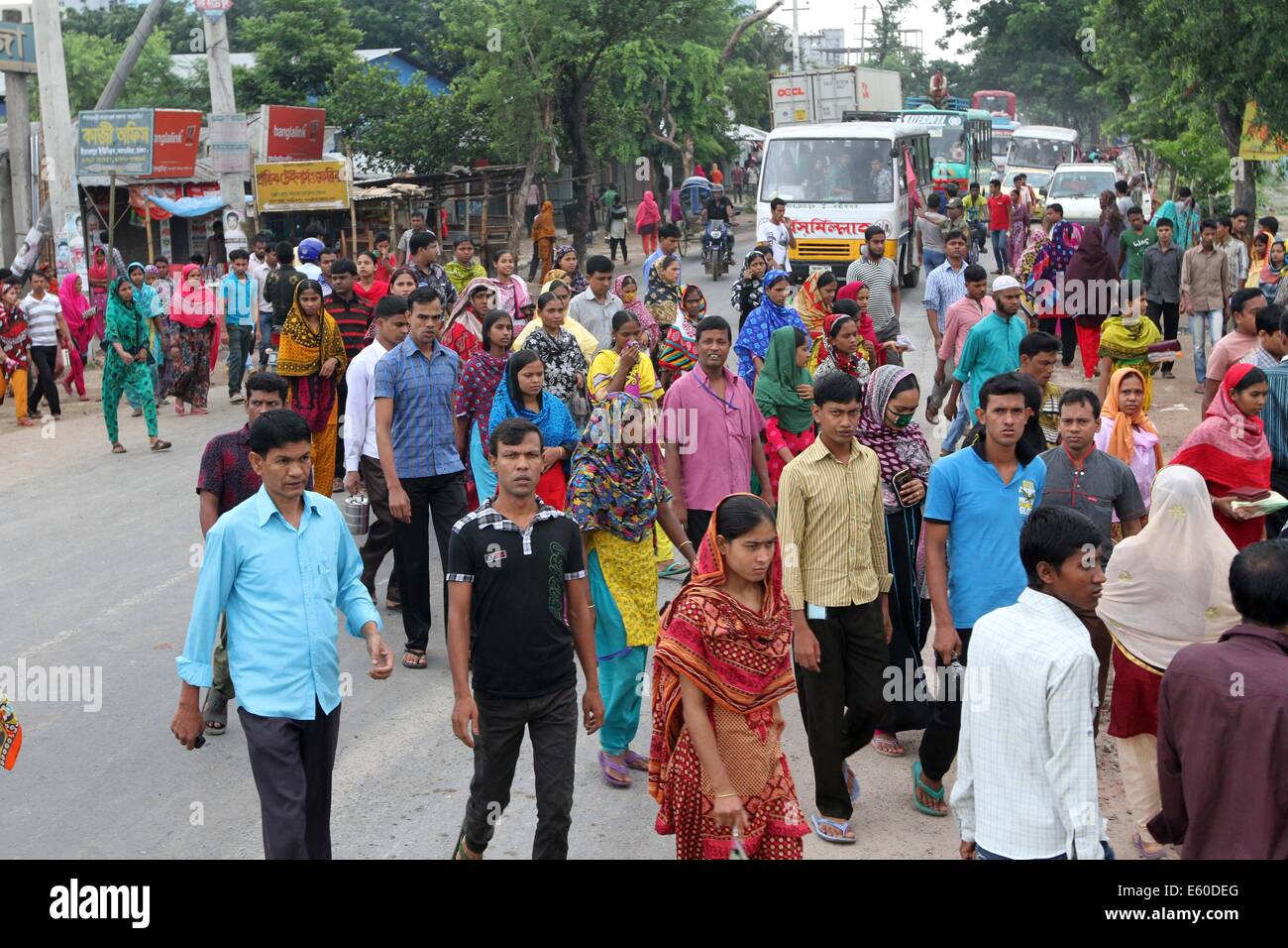 Garment workers are in a long queue to join their workplace in Ashulia ...