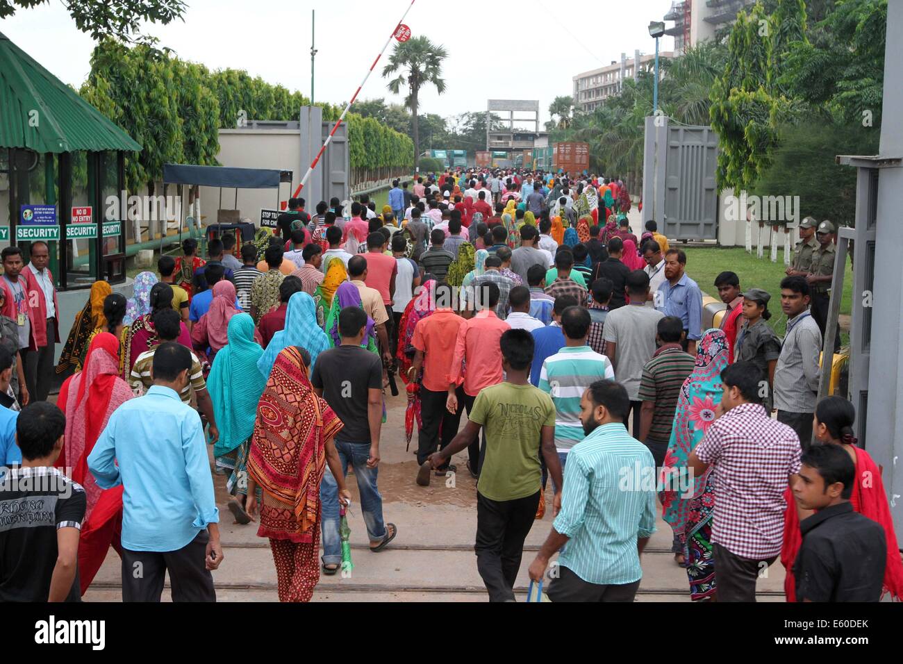Garment workers are in a long queue to join their workplace in Ashulia ...