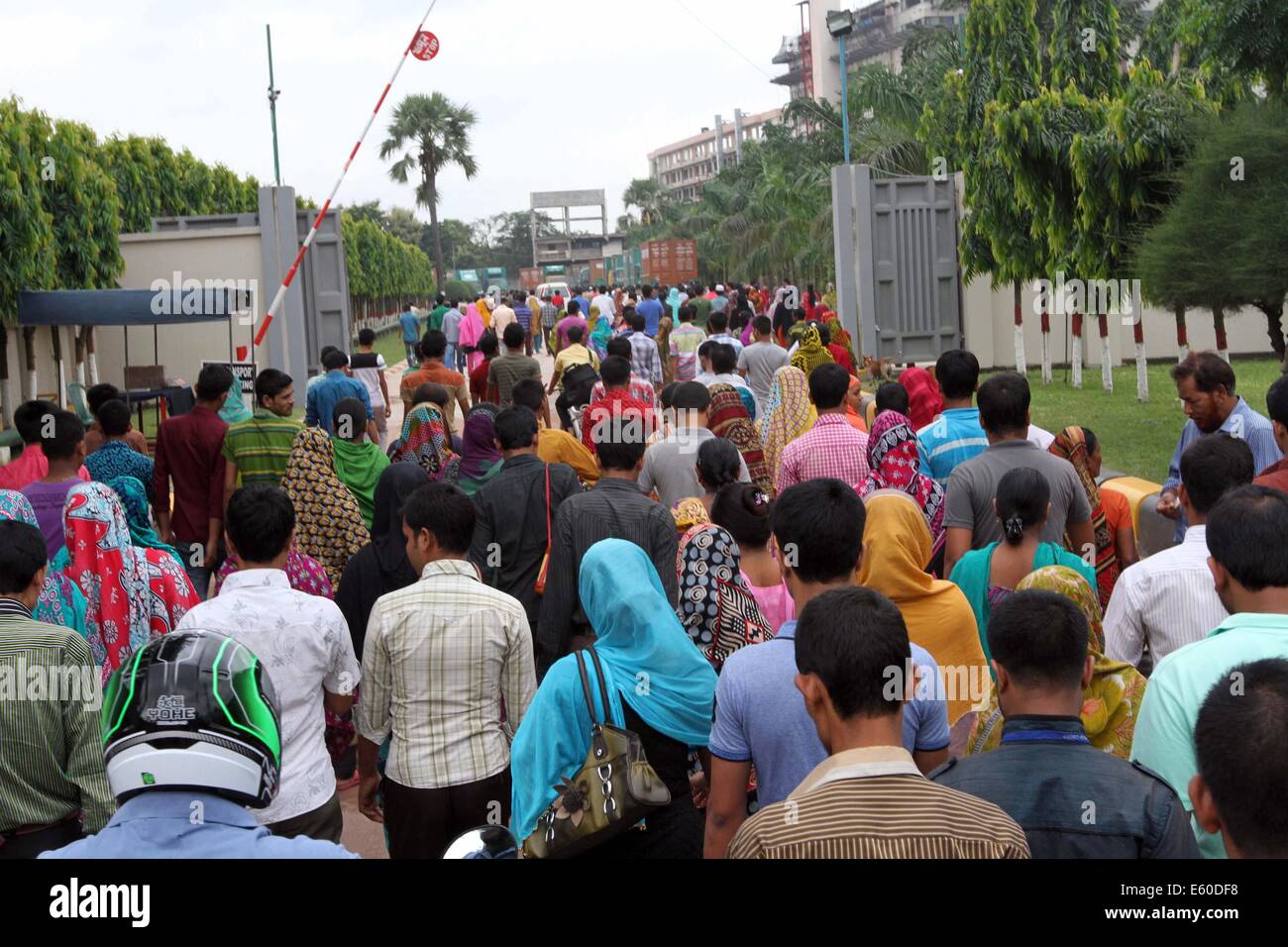 Garment workers are in a long queue to join their workplace in Ashulia ...