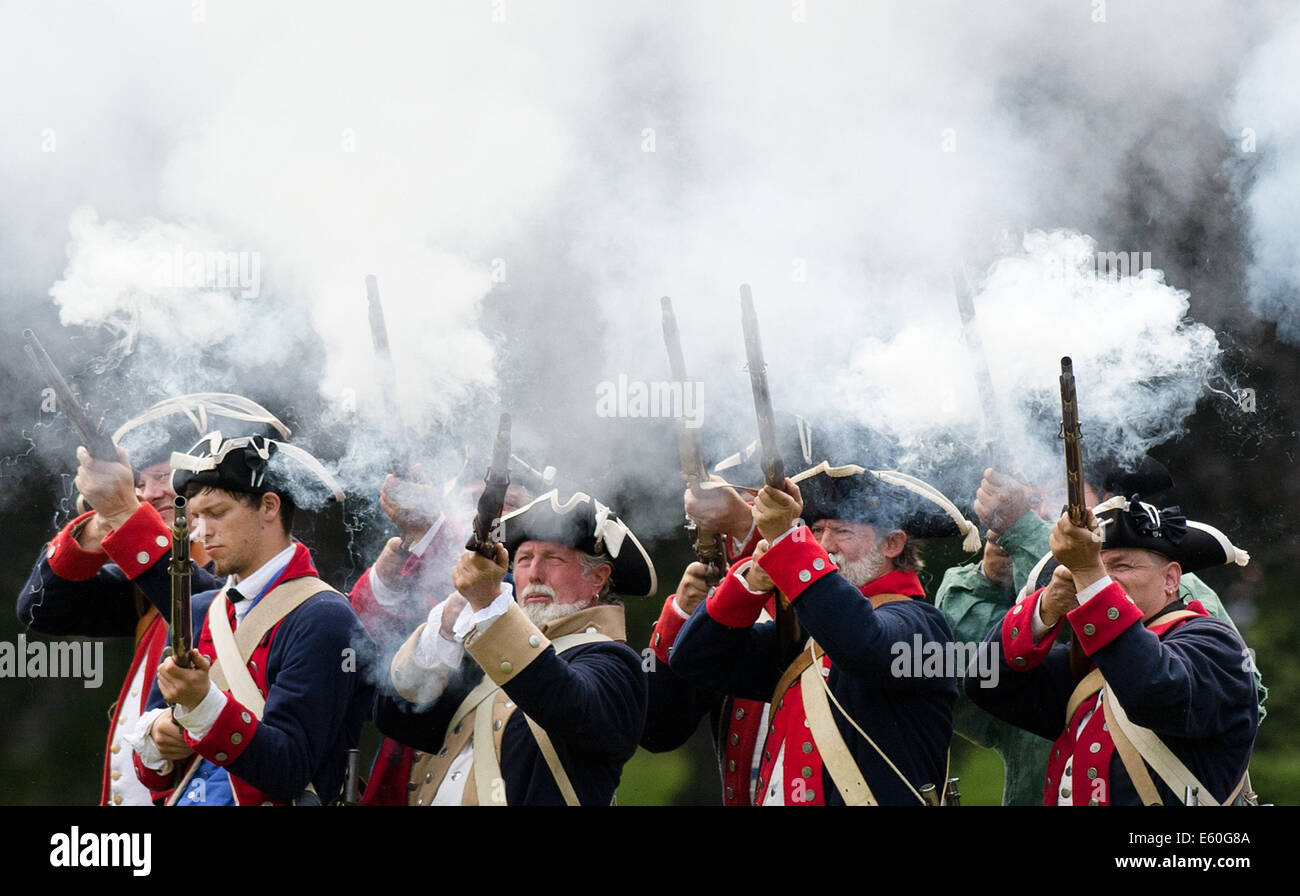 Fulda, Germany. 10th Aug, 2014. Actors fire with muskets during the ...