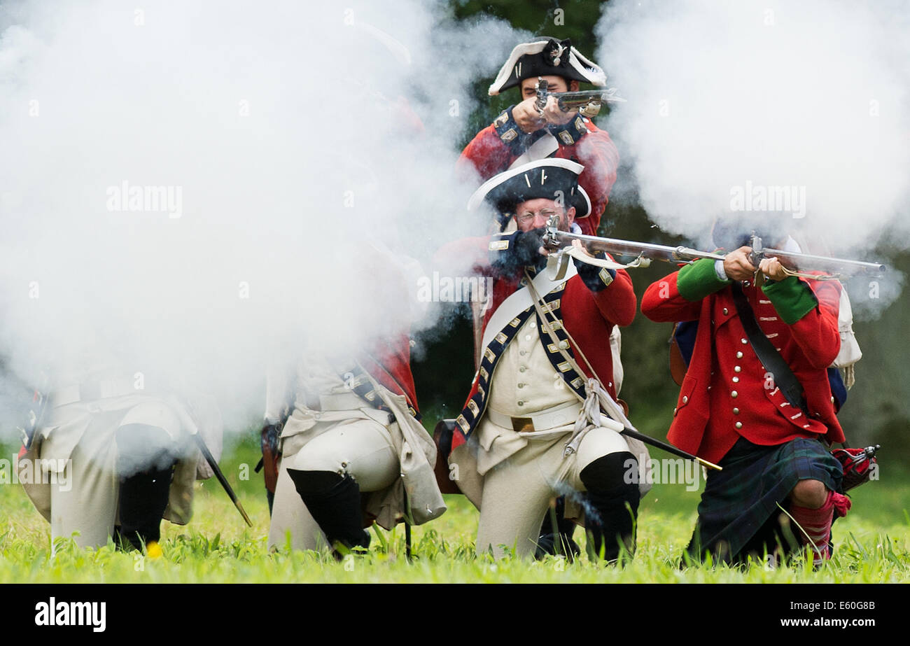 Fulda, Germany. 10th Aug, 2014. Actors fire with muskets during the ...