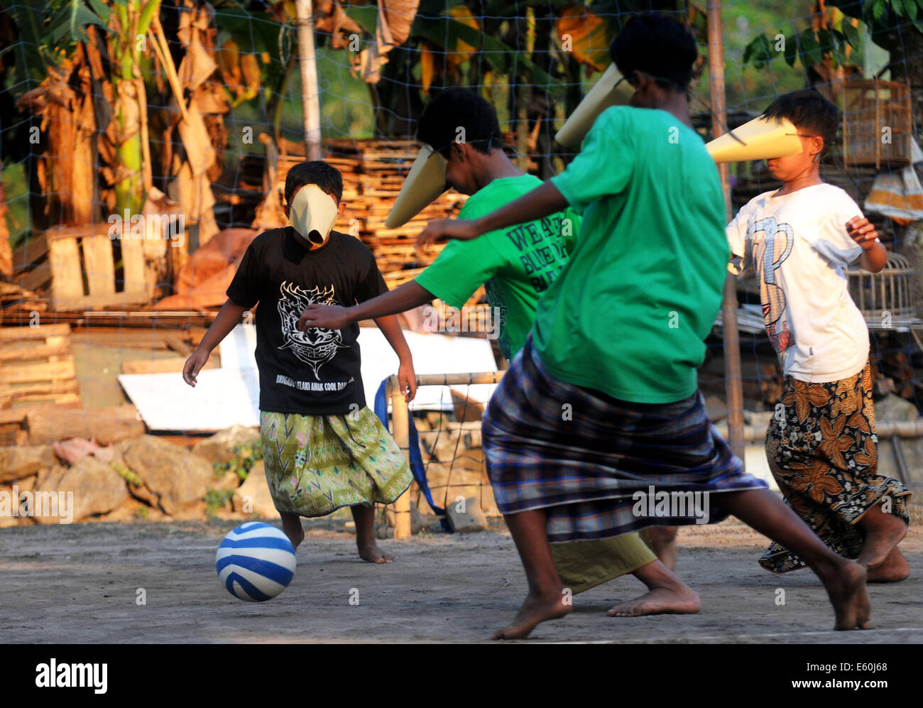 Yogyakarta, Indonesia. 10th Aug, 2014. Children play a football match ...