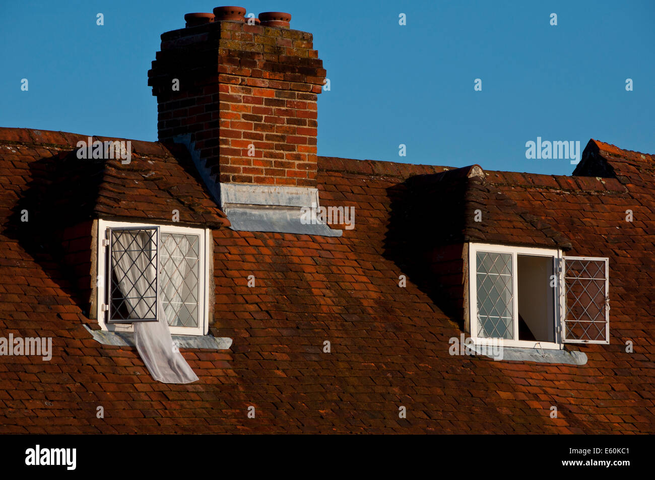 Dormer window in old tiled roof Stock Photo - Alamy