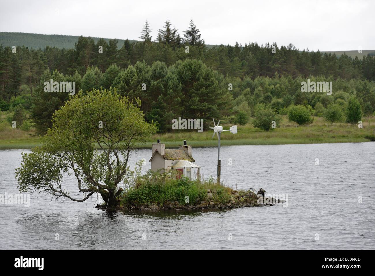 A toy house on an island on Loch Shin at Lairg, Highland, Scotland ...