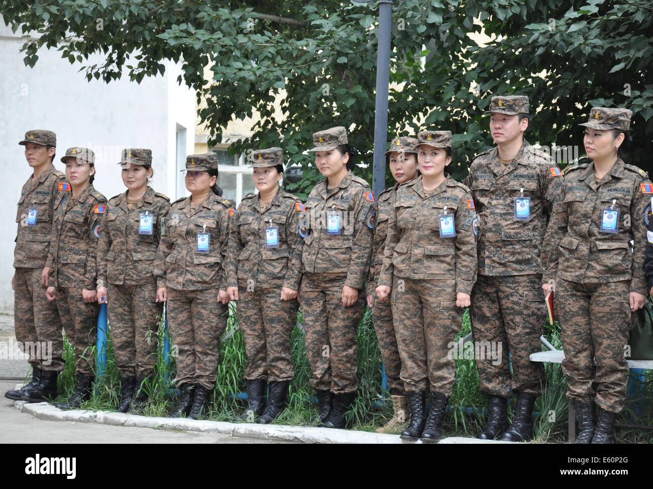 Mongolian soldiers stand in formation for the opening ceremony of the ...