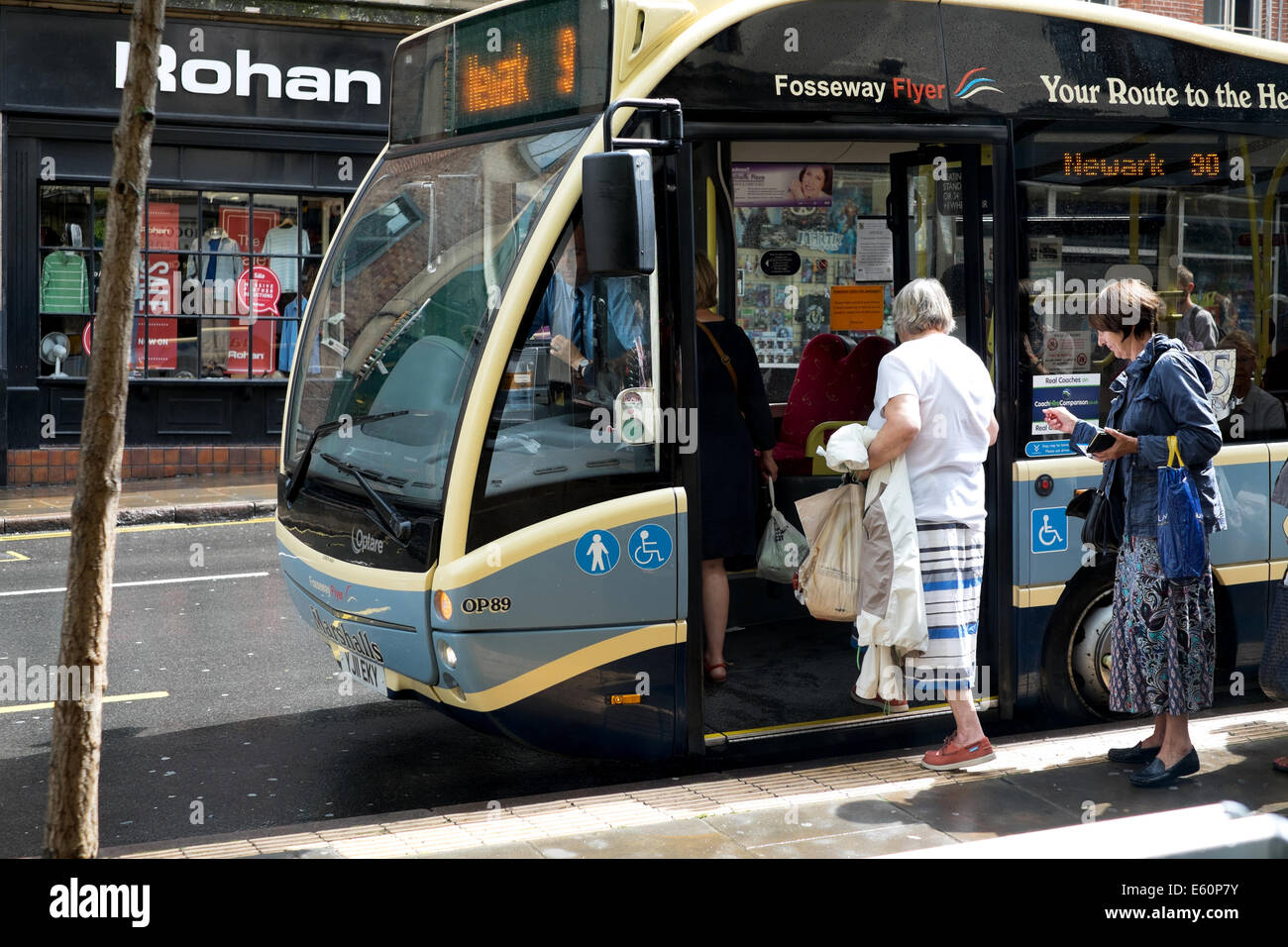 People Boarding Bus At Stop Stock Photo - Alamy