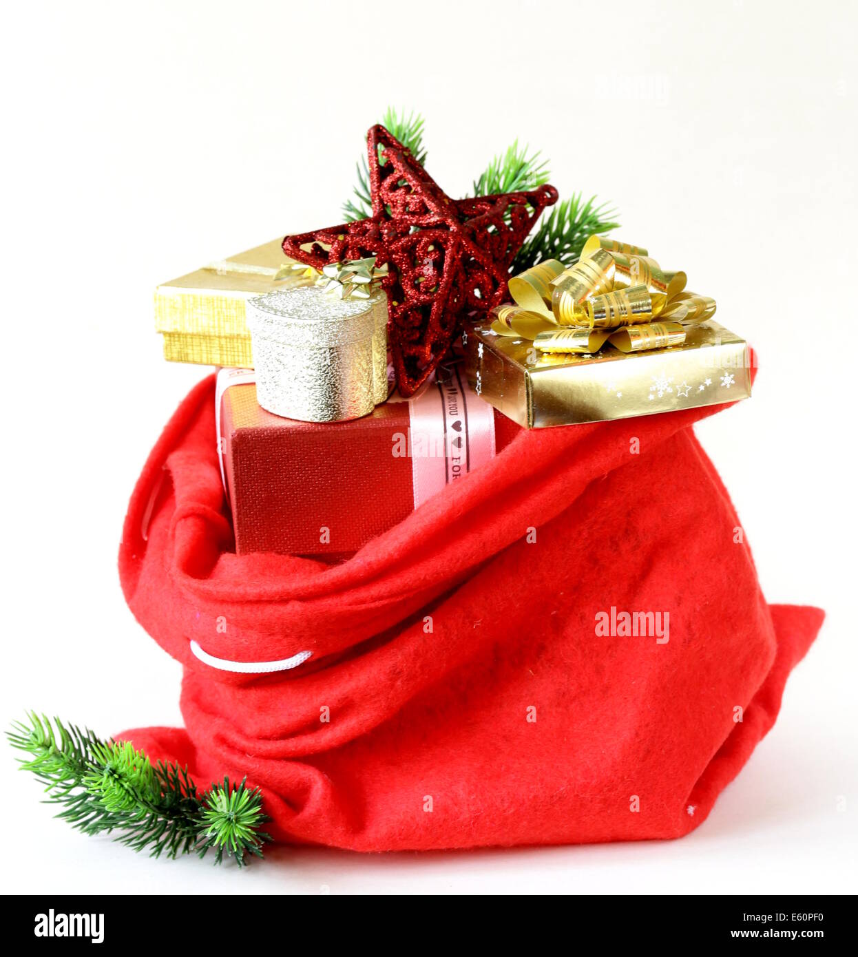 red bag full of Christmas gifts, boxes and decorations Stock Photo - Alamy