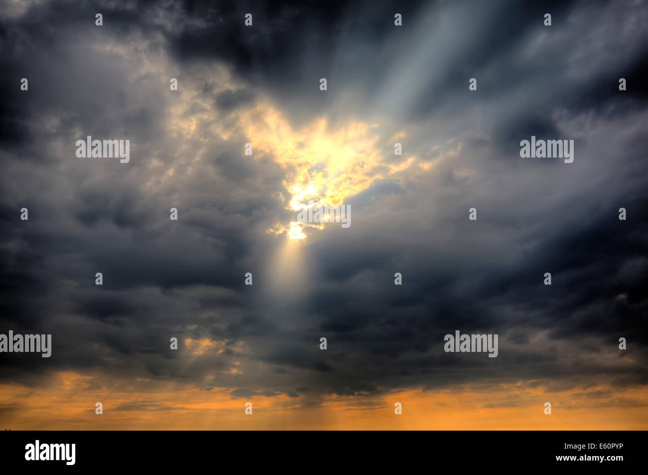 Sunset in the rising storm Stock Photo - Alamy