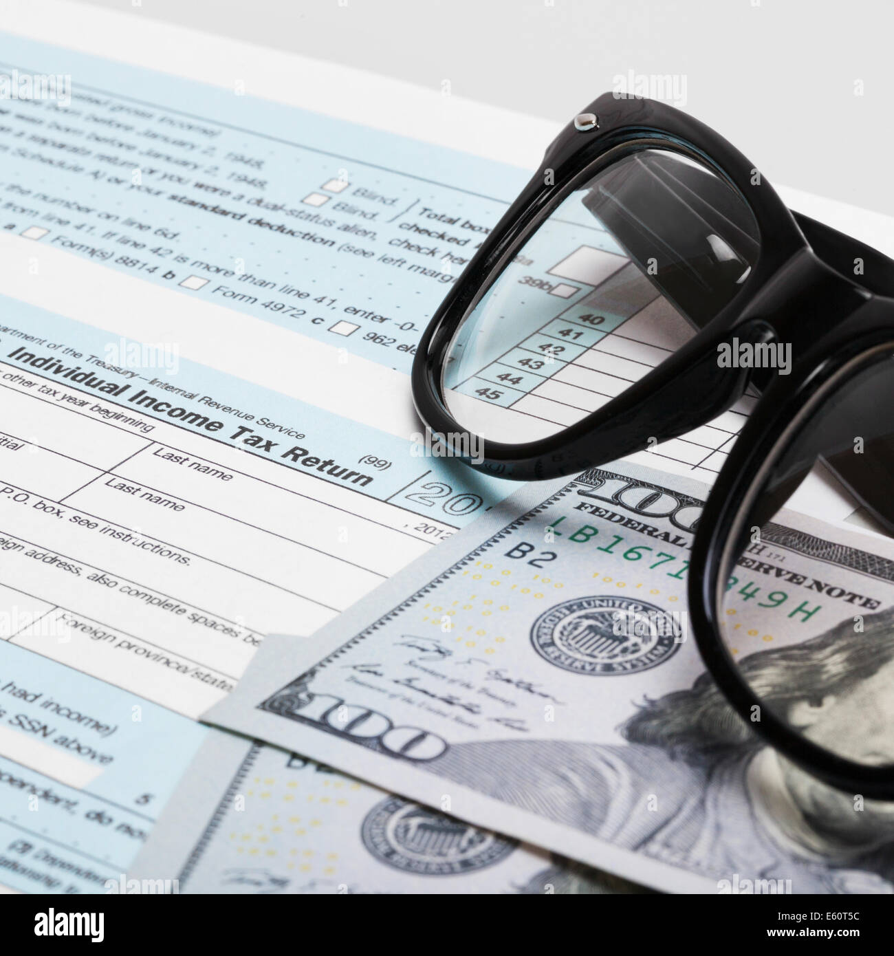 USA 1040 Tax Form with glasses and two 100 US dollar bills Stock Photo ...