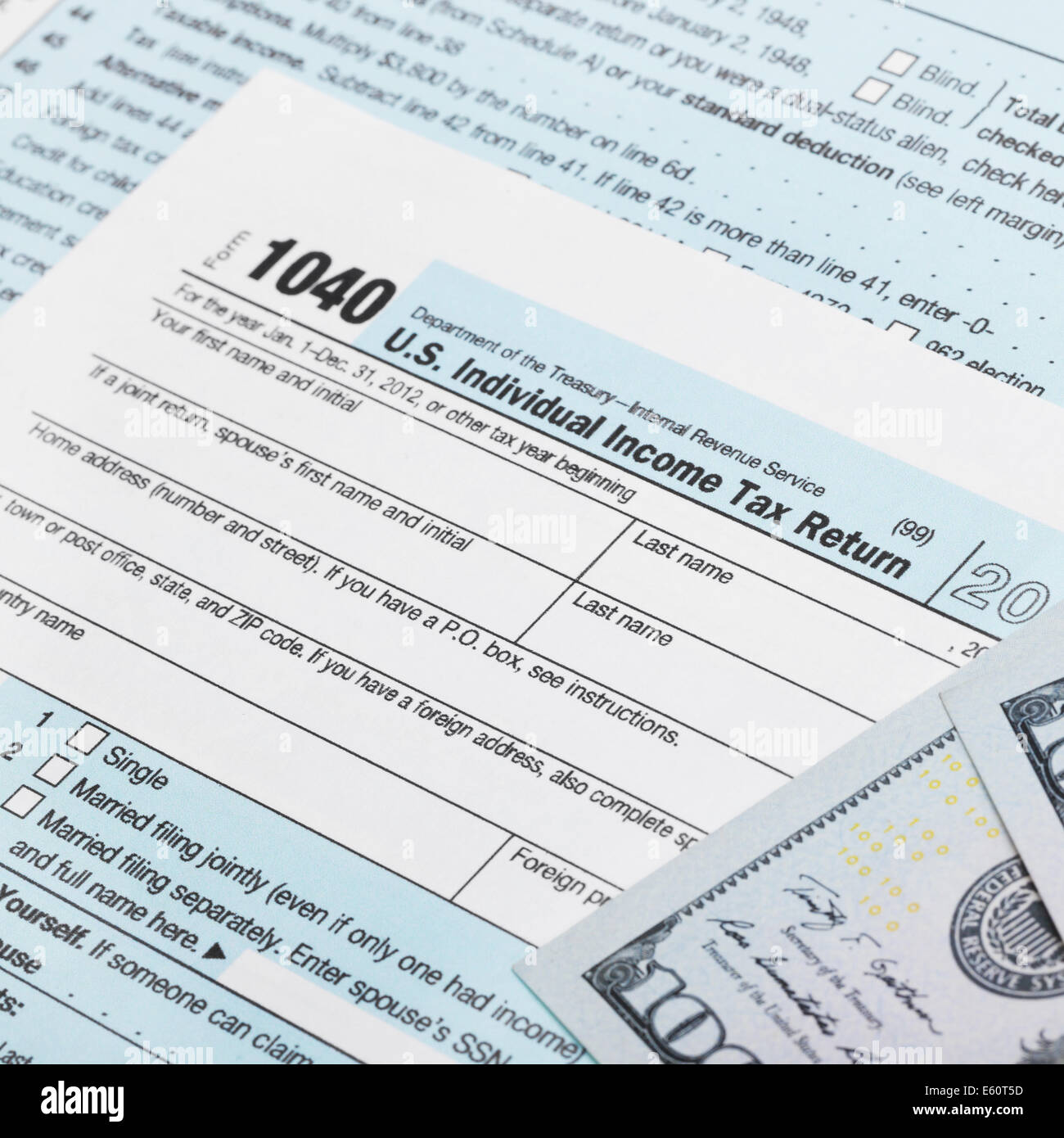 USA Tax Form 1040 with 100 US dollar bills Stock Photo - Alamy
